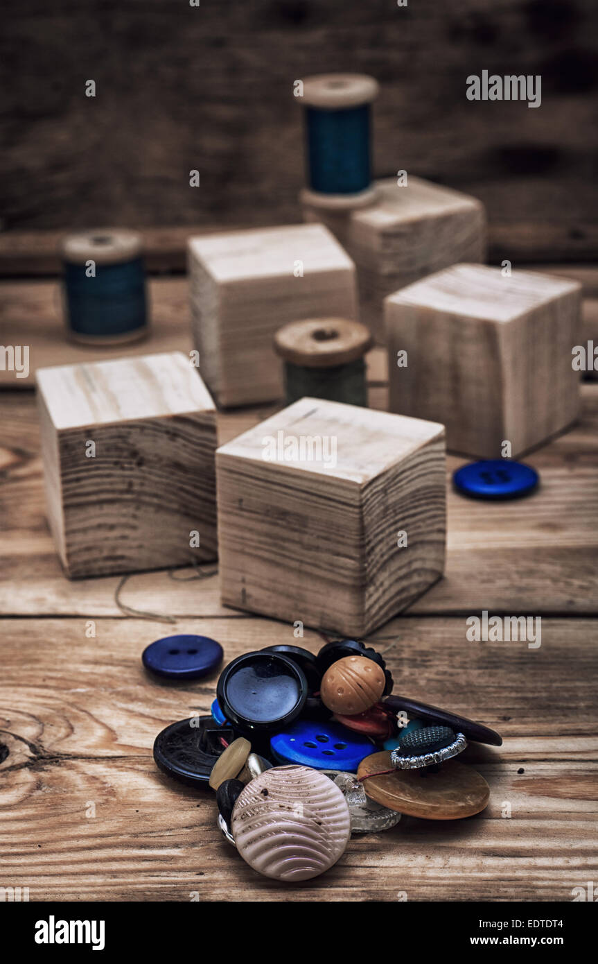 spool sewing thread and buttons in vintage style Stock Photo - Alamy