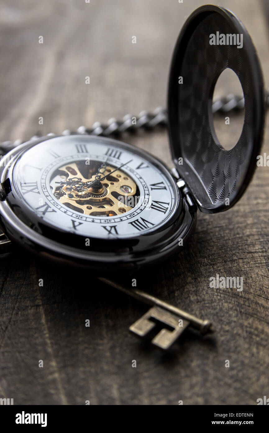pocket watch on grunge wooden table, close up Stock Photo - Alamy