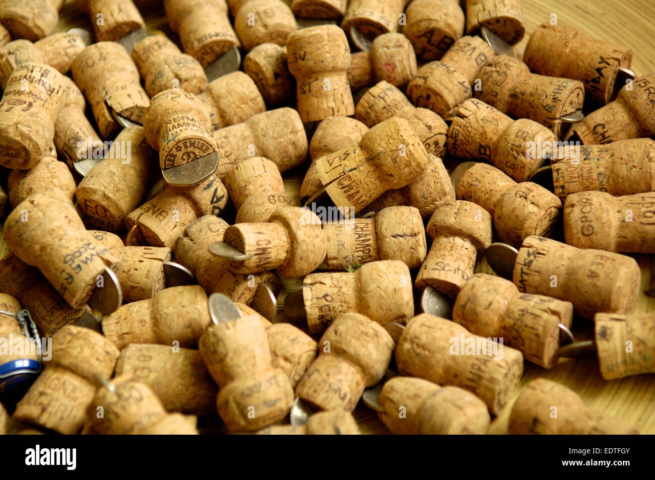 Champagne corks with coins in Stock Photo - Alamy