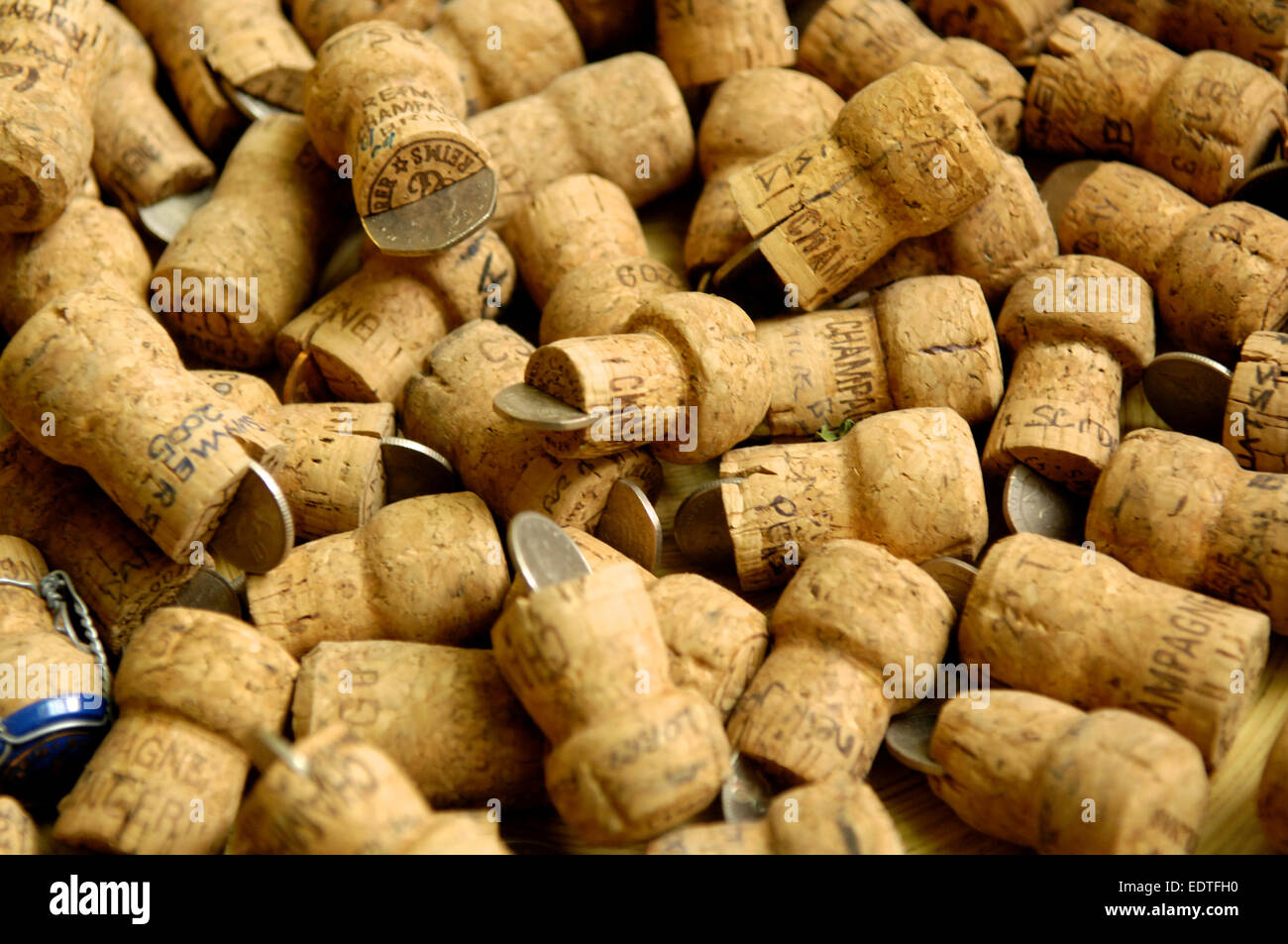 Champagne corks with coins in Stock Photo - Alamy