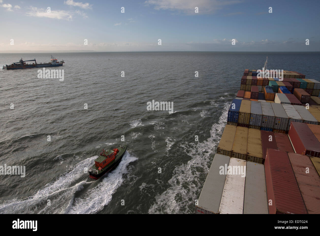 A pilot launch arrives alongside the Panama-registered container ship ...