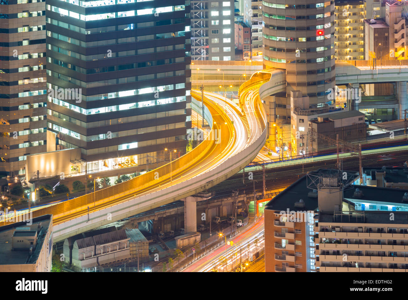 Osaka skyline with highway through its building at night, Japan Stock ...