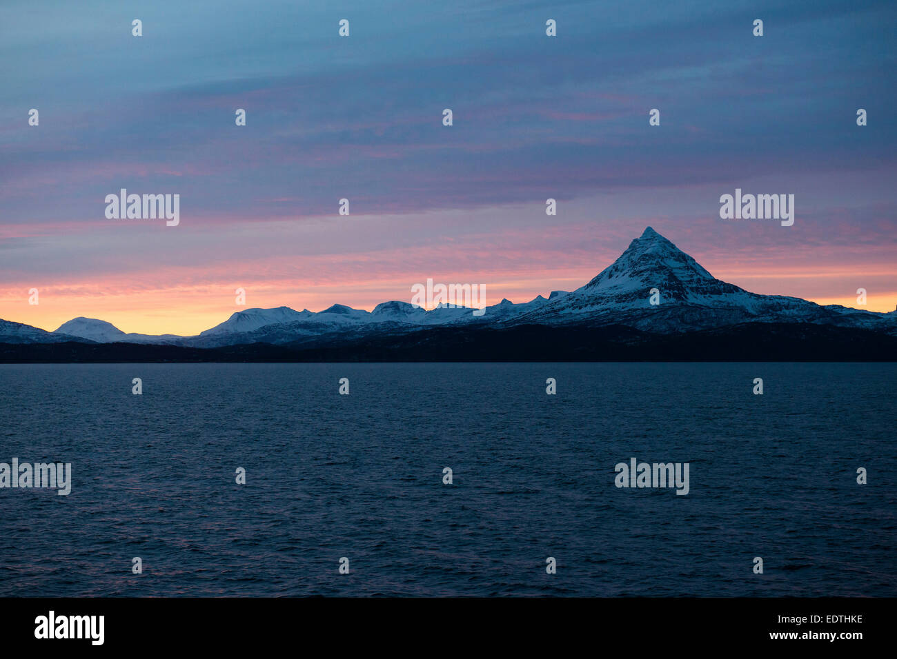 Coastline with sharp peaks at the Tranøyfjord in the light of the early ...