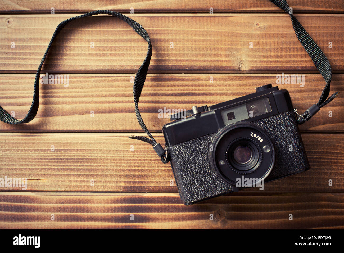 top view of retro camera on wooden table Stock Photo - Alamy