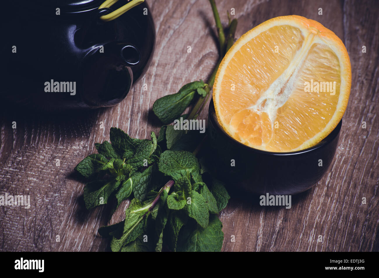 orange and mint tea served in cup and teapot Stock Photo - Alamy