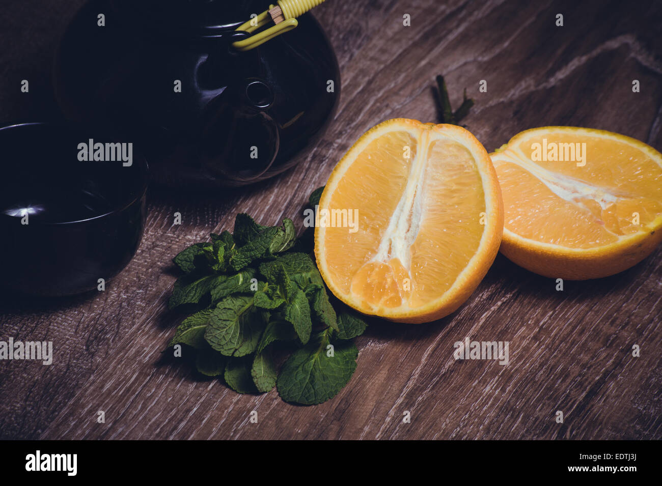 orange and mint tea served in cup and teapot Stock Photo - Alamy
