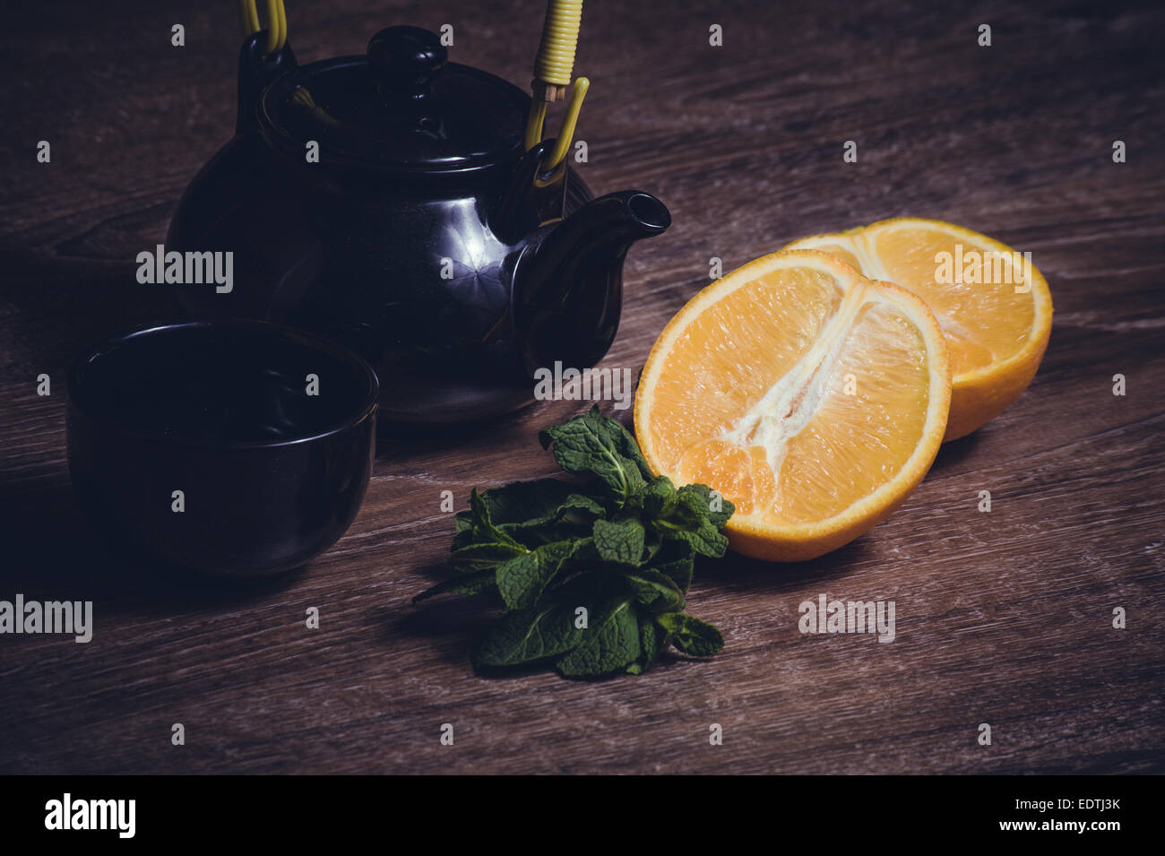 orange and mint tea served in cup and teapot Stock Photo - Alamy