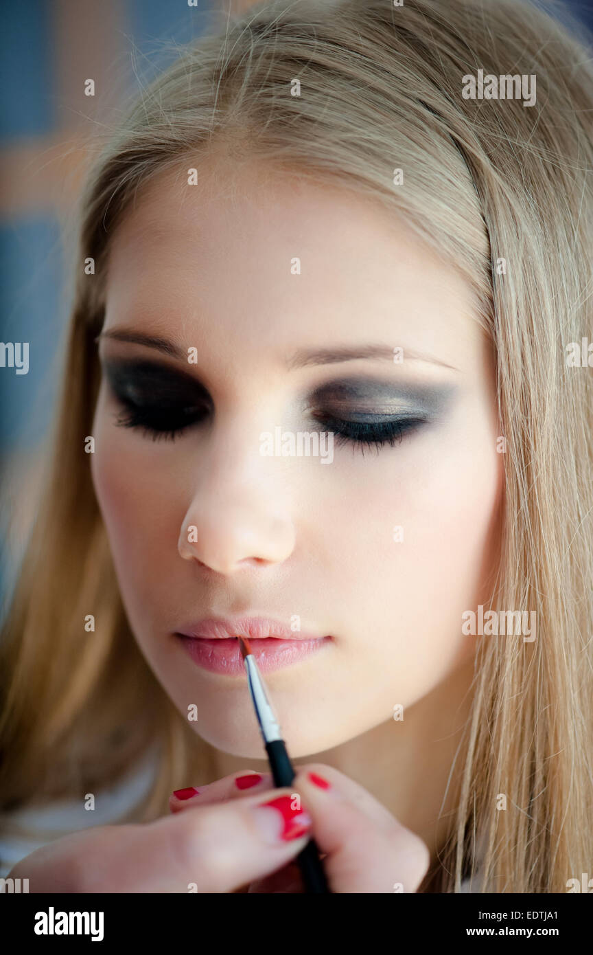 Applying makeup model hi-res stock photography and images - Alamy