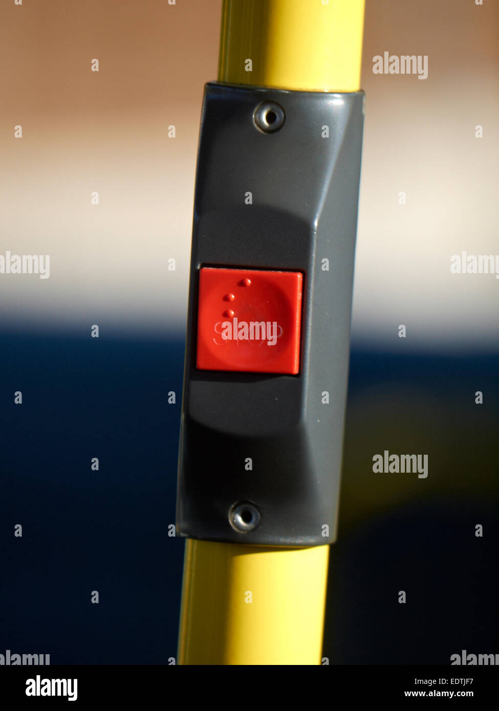 Bus stop button with braille Stock Photo - Alamy