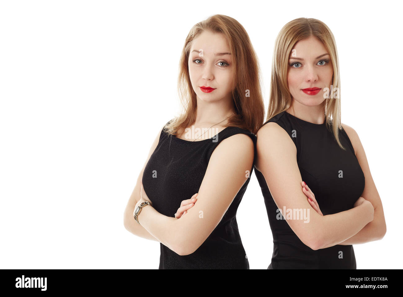 Concept of teamwork. Girls posing back-to-back Stock Photo - Alamy