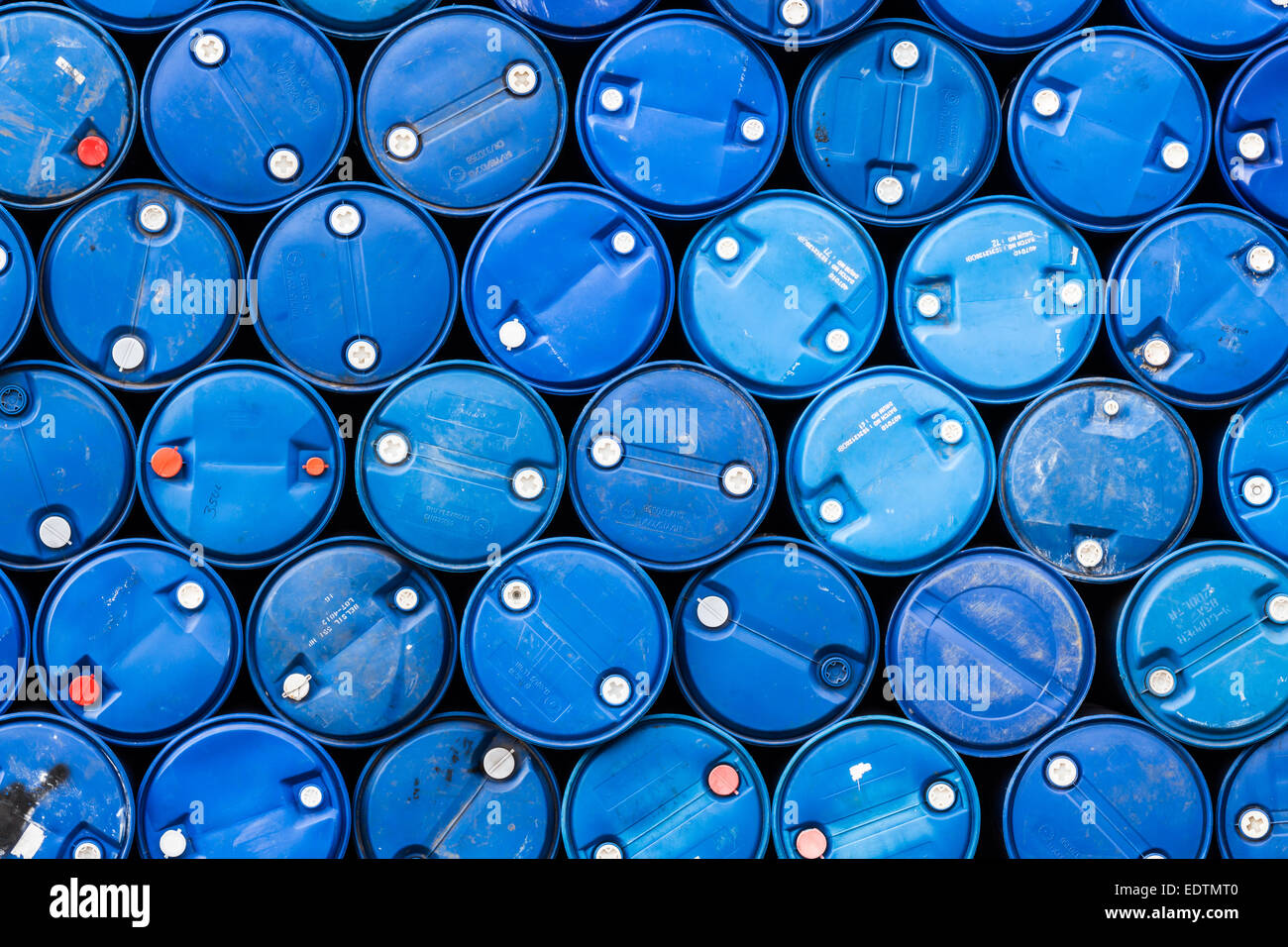 Blue oil barrels background Stock Photo - Alamy