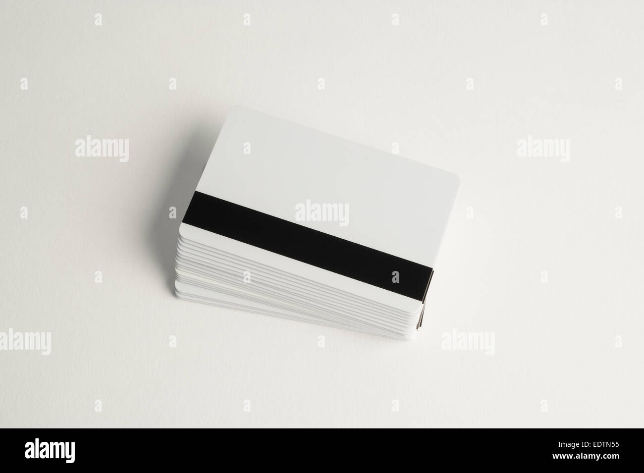 Stack of blank credit cards showing magnetic strip Stock Photo - Alamy