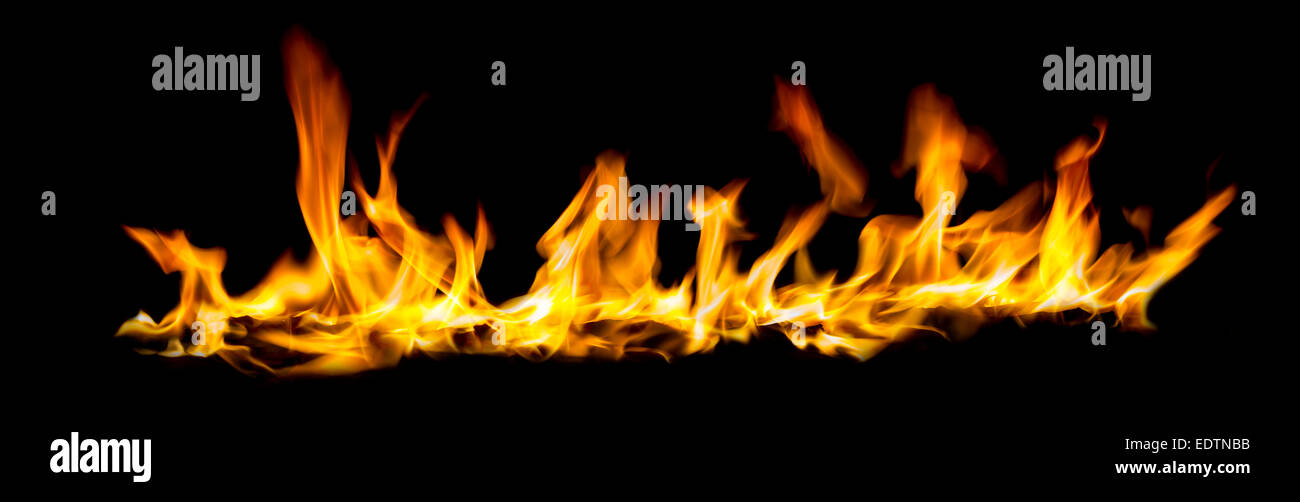 wide angel view of fire isolated on black background Stock Photo - Alamy
