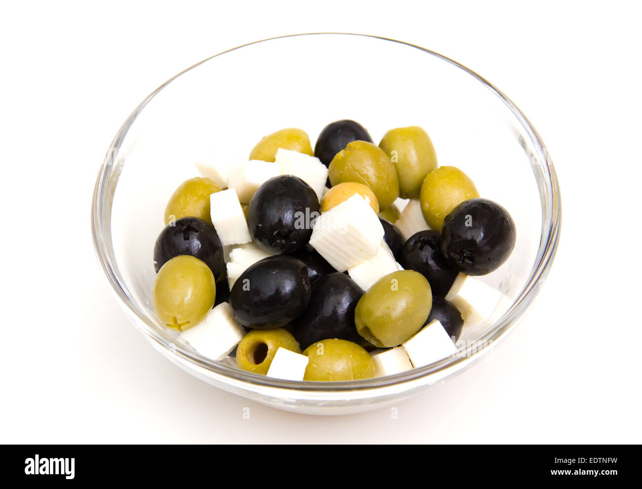 Olives with cheese on bowl on white background Stock Photo - Alamy