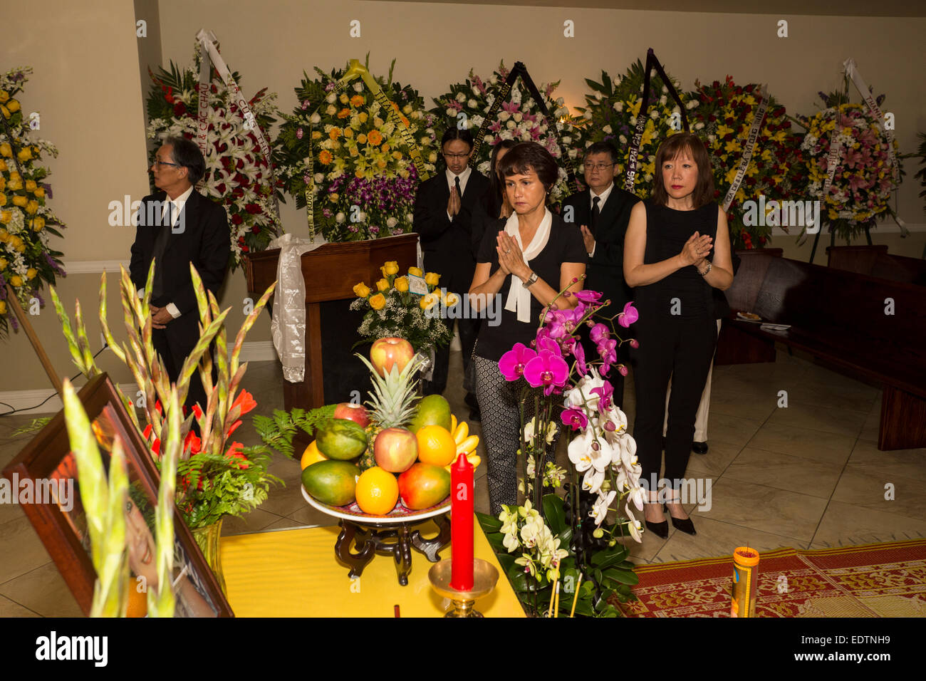 Family members, friends, mourners at Vietnamese funeral service, Little Saigon district, city of ...