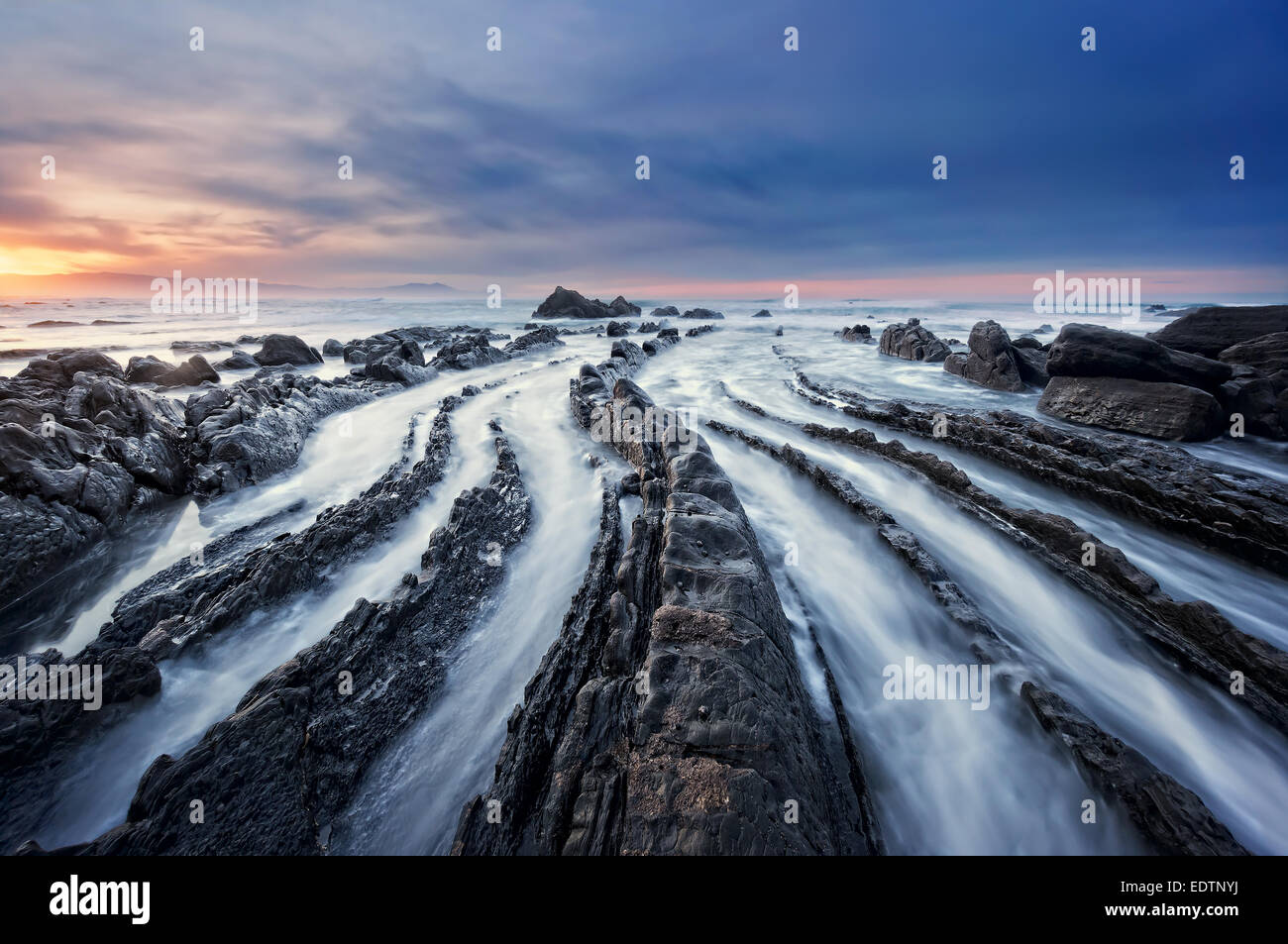 Barrika beach at sunset with long exposure Stock Photo - Alamy