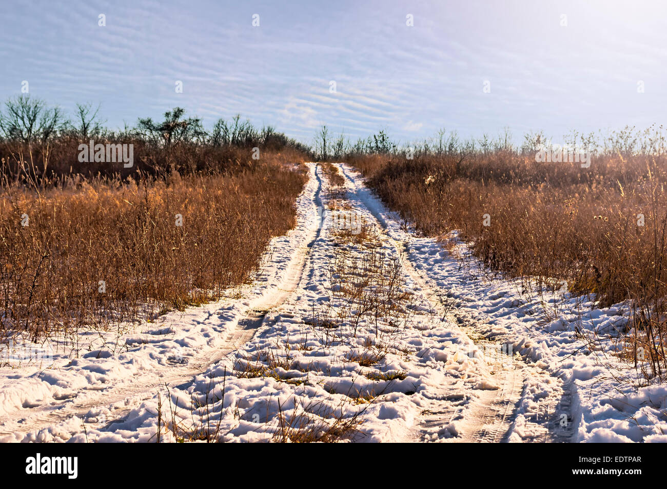 Empty snow covered road in winter landscape Stock Photo - Alamy