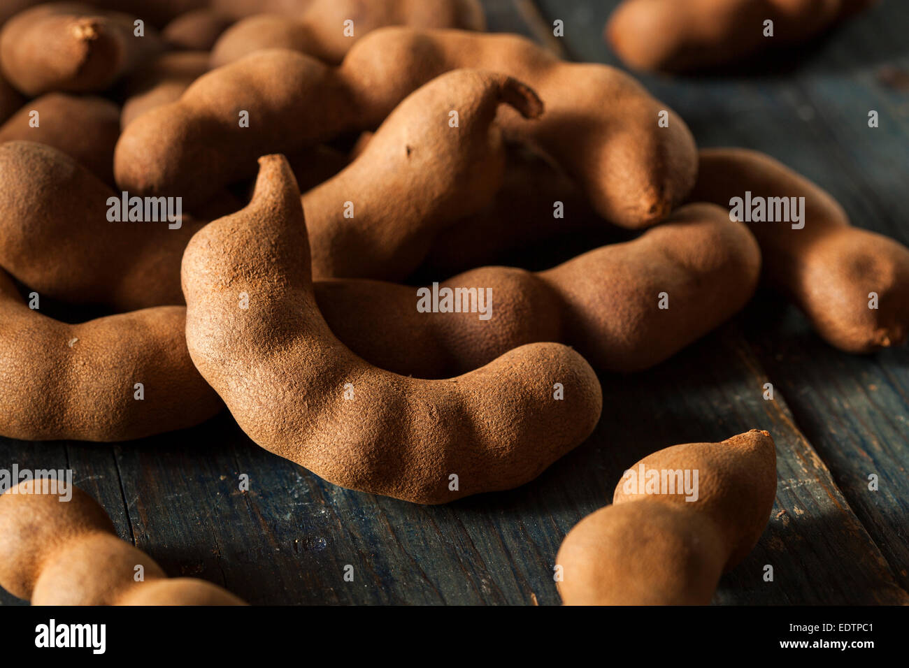 Organic Raw Brown Tamarind on a Background Stock Photo - Alamy