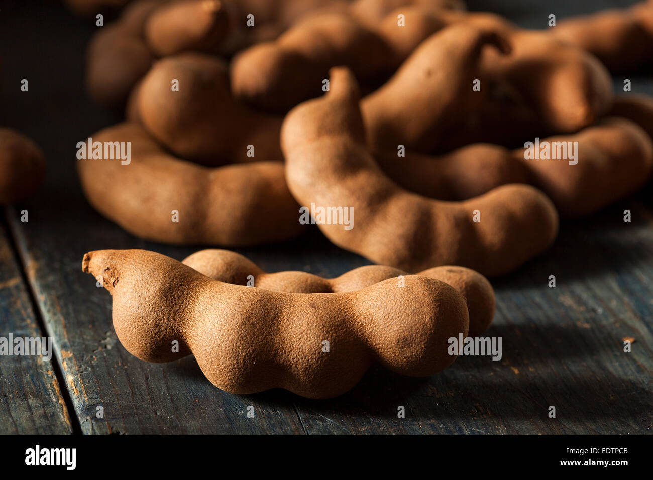 Organic Raw Brown Tamarind on a Background Stock Photo - Alamy