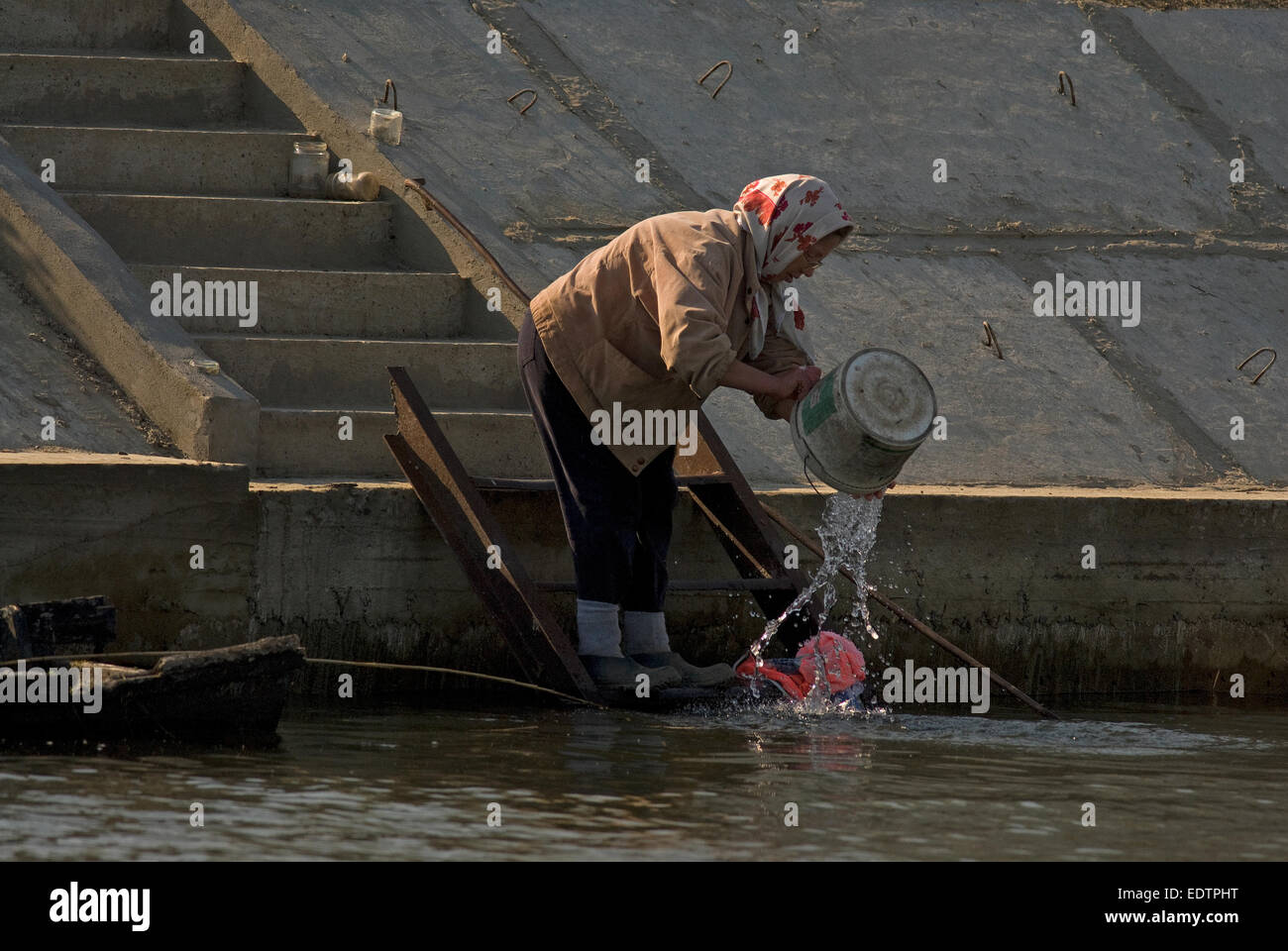 Woman washing clothes in Danube delta, Romania, Europa Stock Photo - Alamy