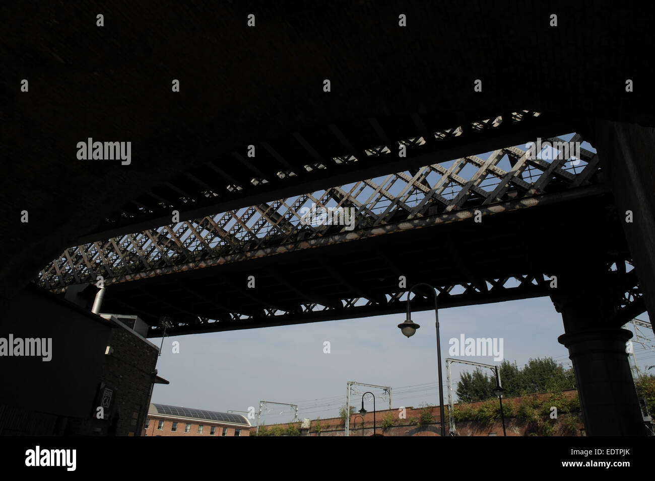 Dark wrought iron truss girder cornbrook viaduct crossing foreground ...