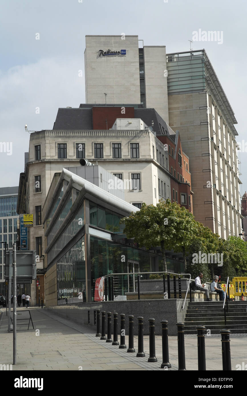 Sunny portrait along Peter Street pavement to wedge-shaped Pavilion ...