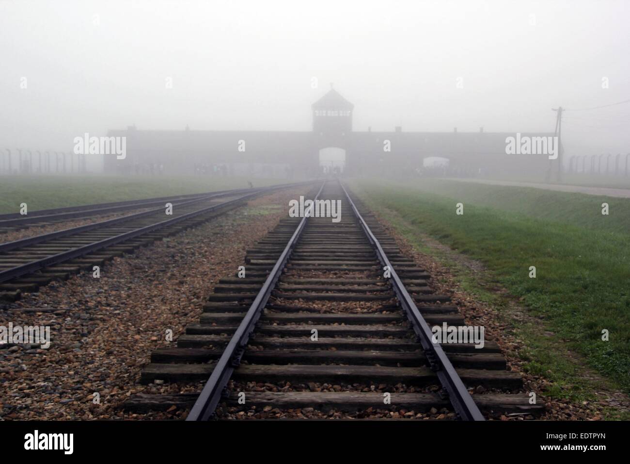 The main gate house of Auschwitz concentration camp is covered in mist ...