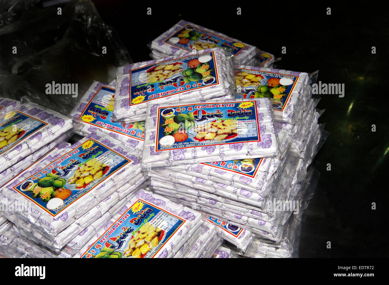 Large pile of stacked toffee packages at toffee manufacturing shed in ...