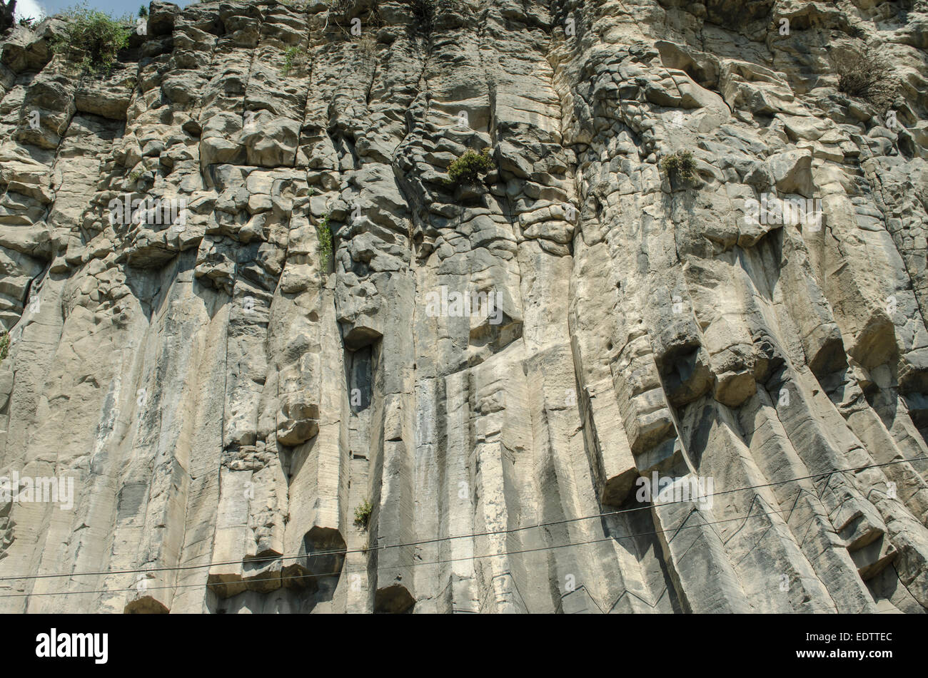 Basalt wall near the road Stock Photo - Alamy