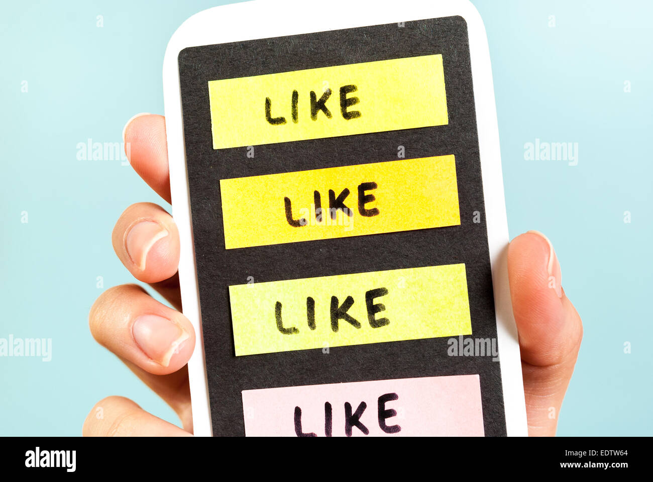 Like buttons on paper smartphone concept Stock Photo - Alamy