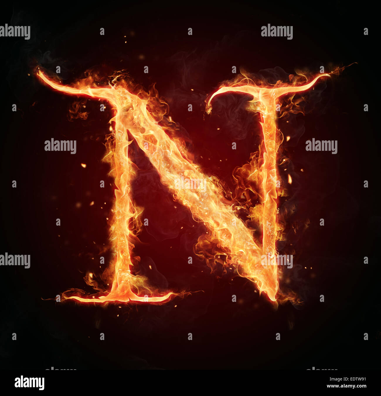 Burning fire letter isolated on black background Stock Photo - Alamy