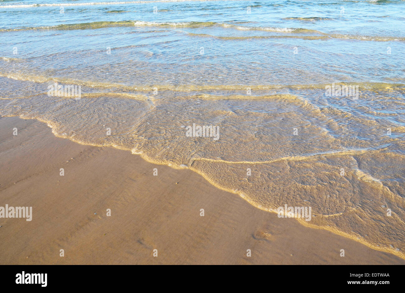 Beautiful wide open Australian beach at early morning in Summer at low ...