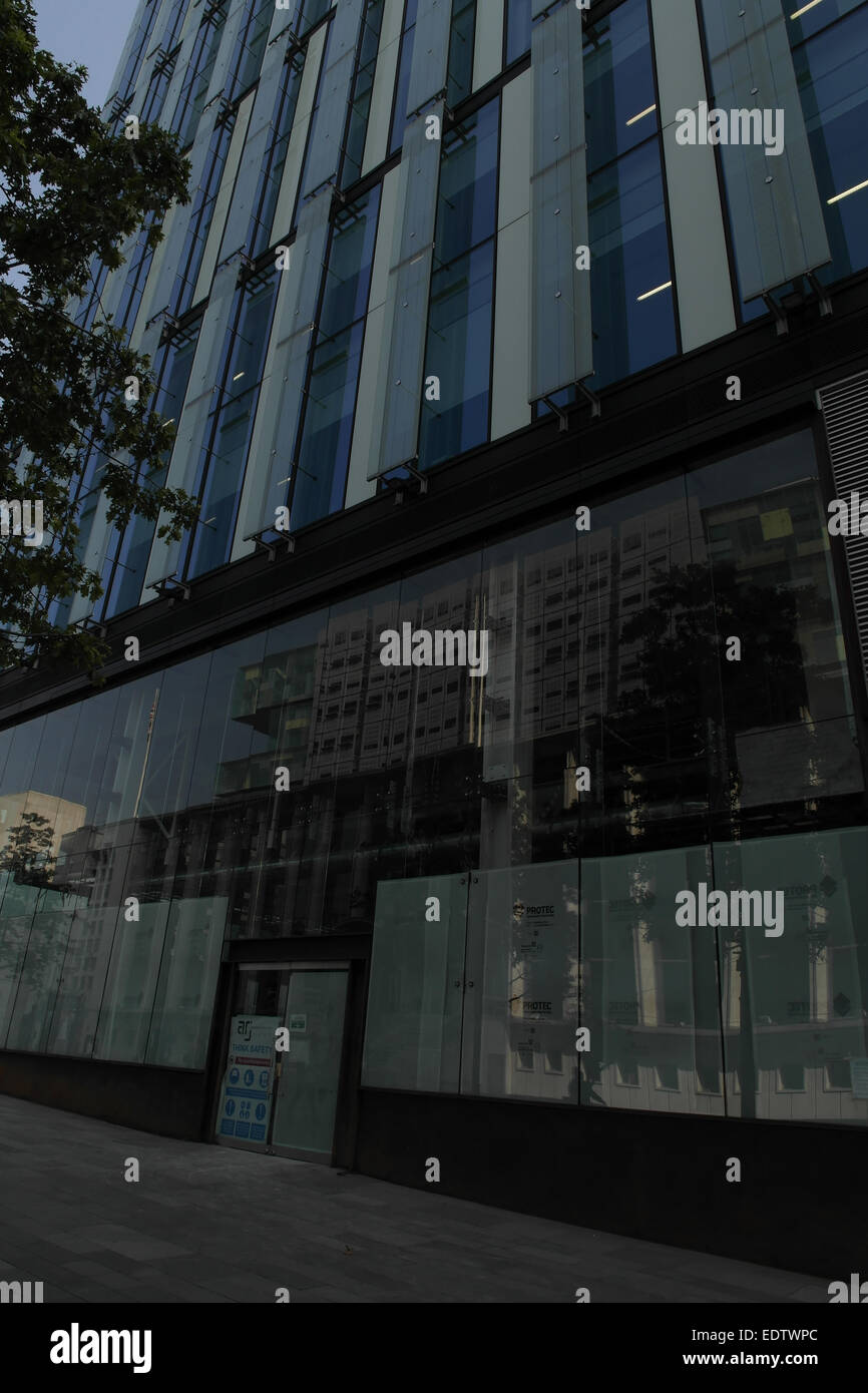 Reflections manchester civil justice centre building reflecting windows ...