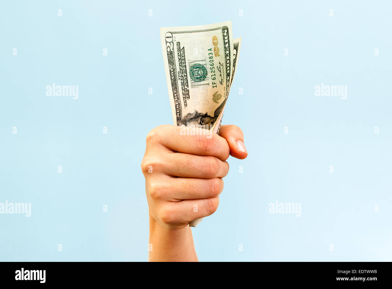 Money in the hand. Hand wielding dollars cash Stock Photo - Alamy