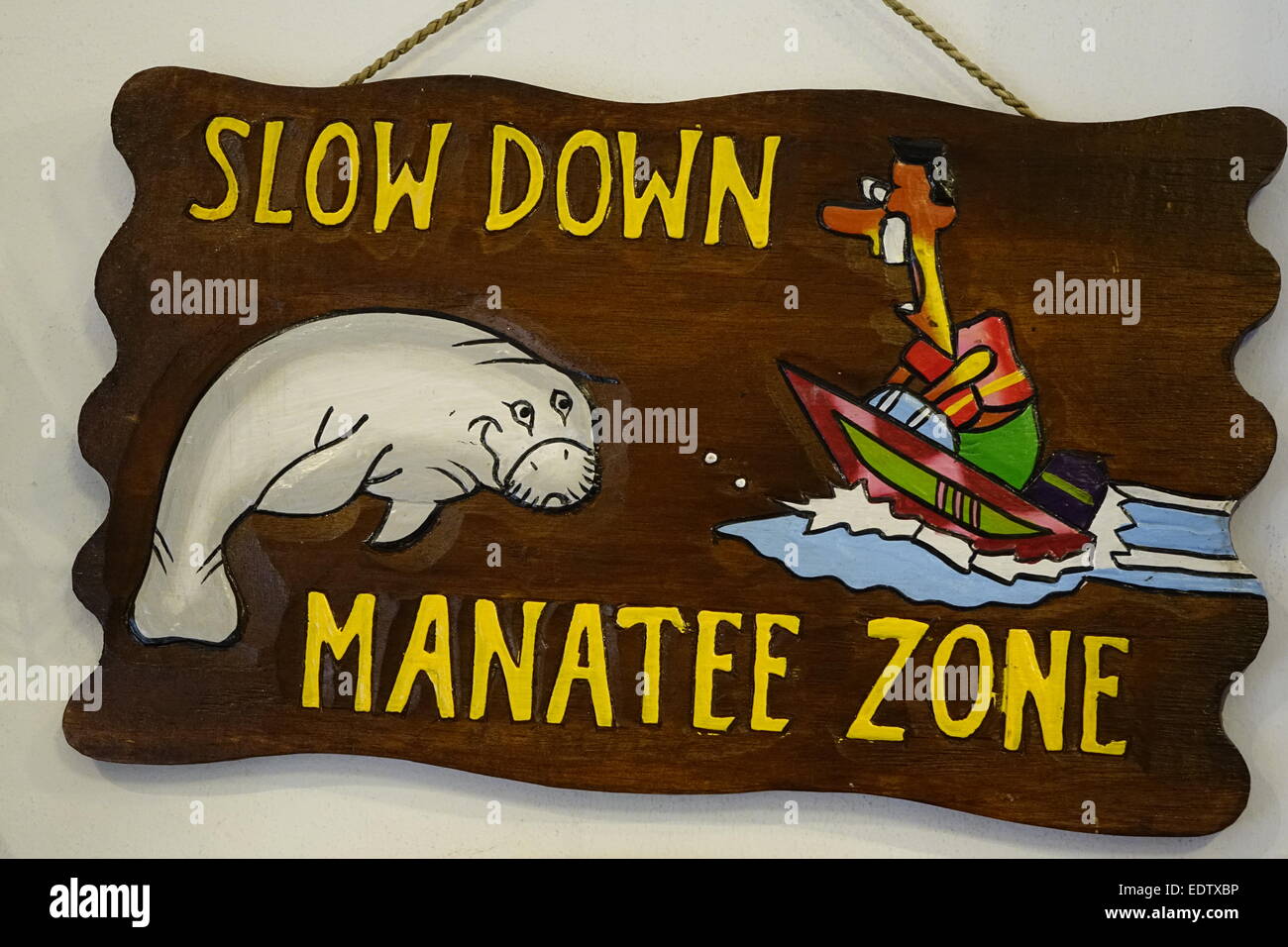 Sign announcing a manatee zone and urging boaters to slow down Stock ...