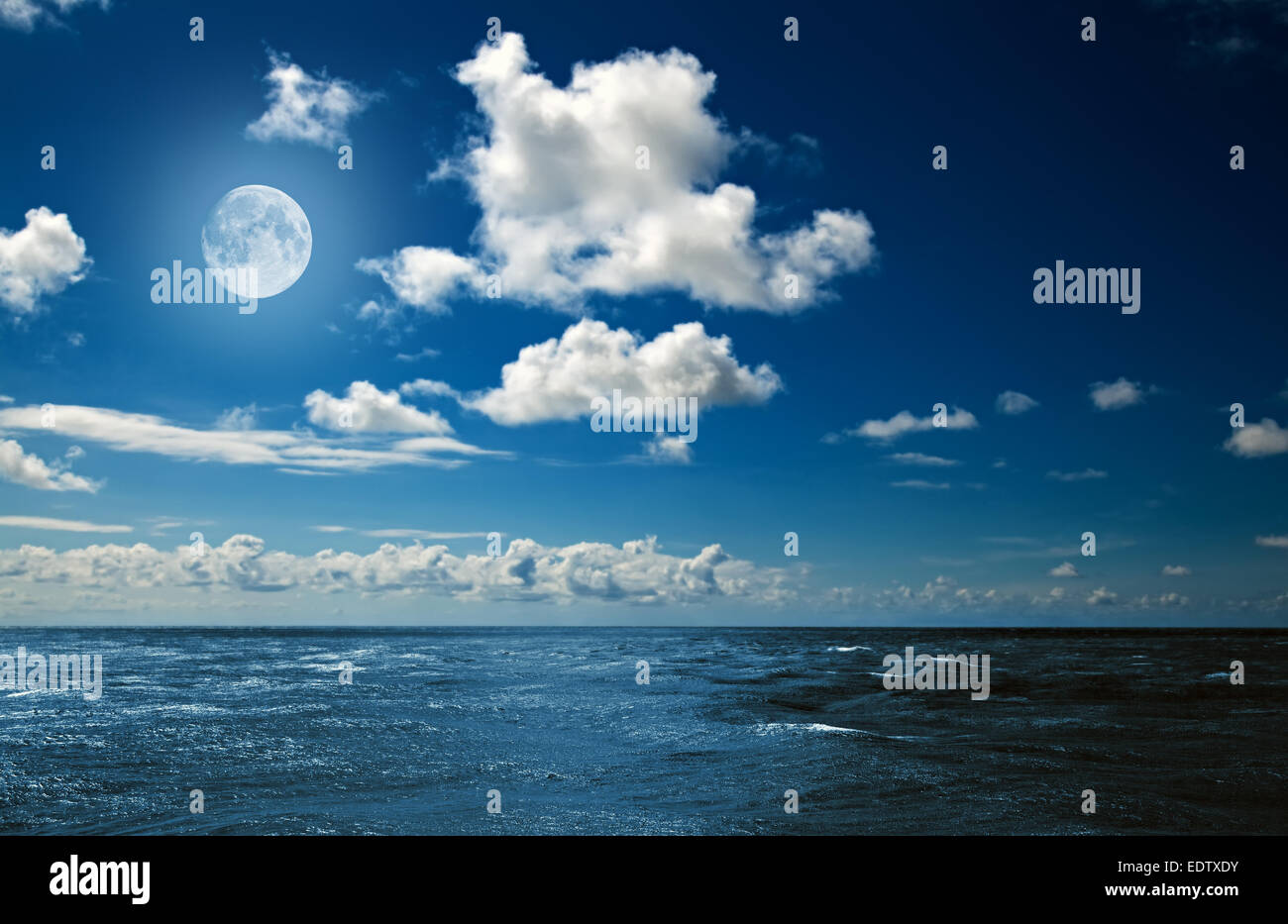 full moon over the ocean Stock Photo - Alamy