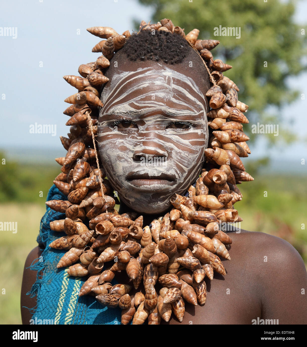 JINKA, ETHIOPIA - NOVEMBER 21, 2014: Young Mursi girl with traditional ...