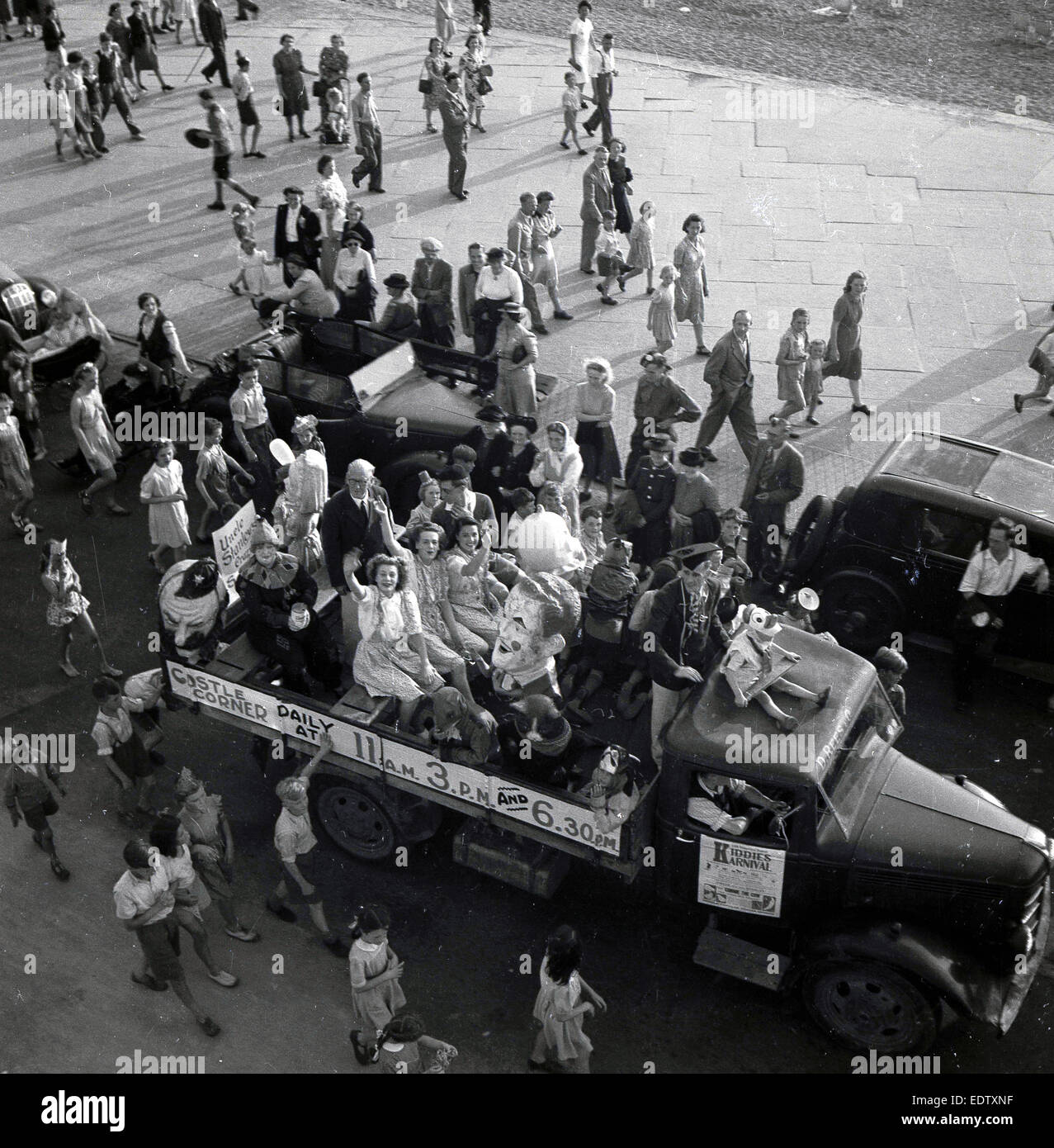 1950s historical picture from above, adults and children sitting in the ...