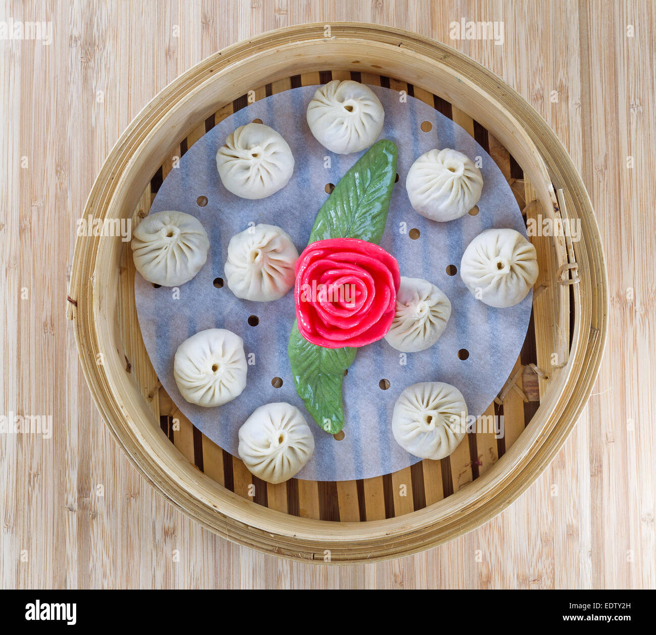 Square top view image of uncooked Chinese Dim sum in bamboo server ...