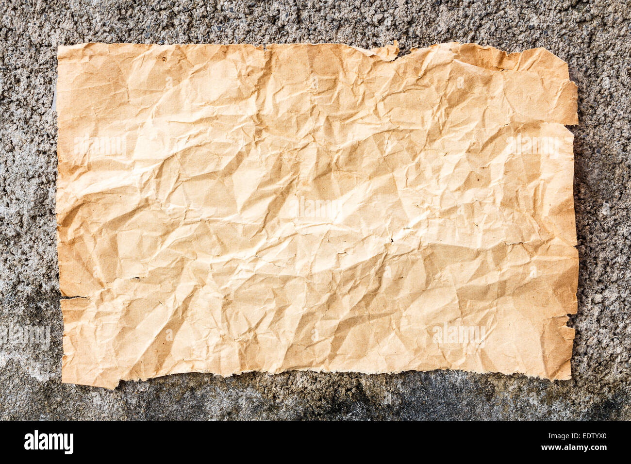 The old crumpled paper on cement wall Stock Photo - Alamy