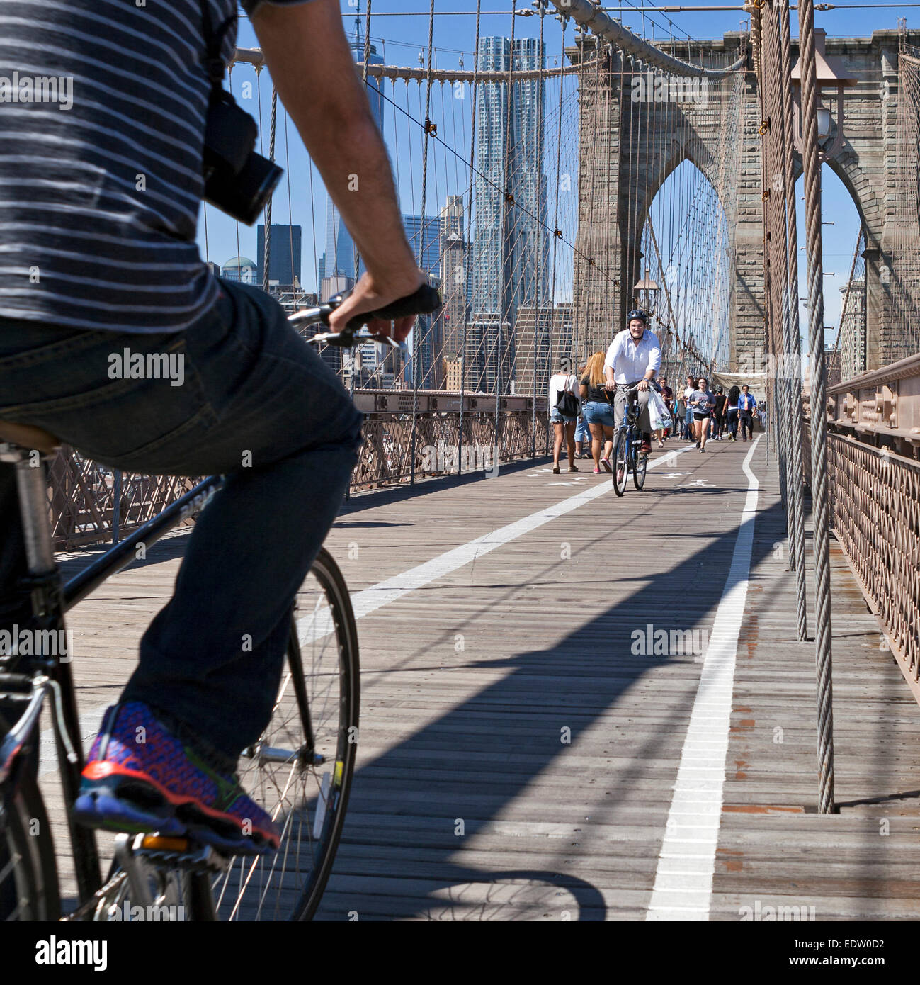 People walk, run, or ride bicycles separately from cars on the Brooklyn ...