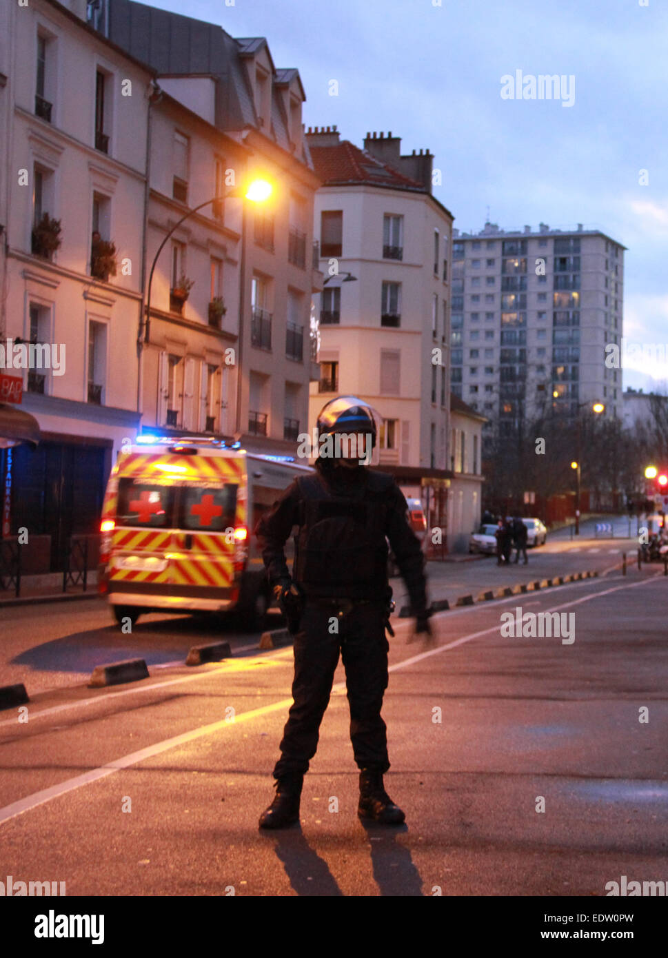 Paris. 9th Jan, 2015. A French policeman stands guard near a kosher ...