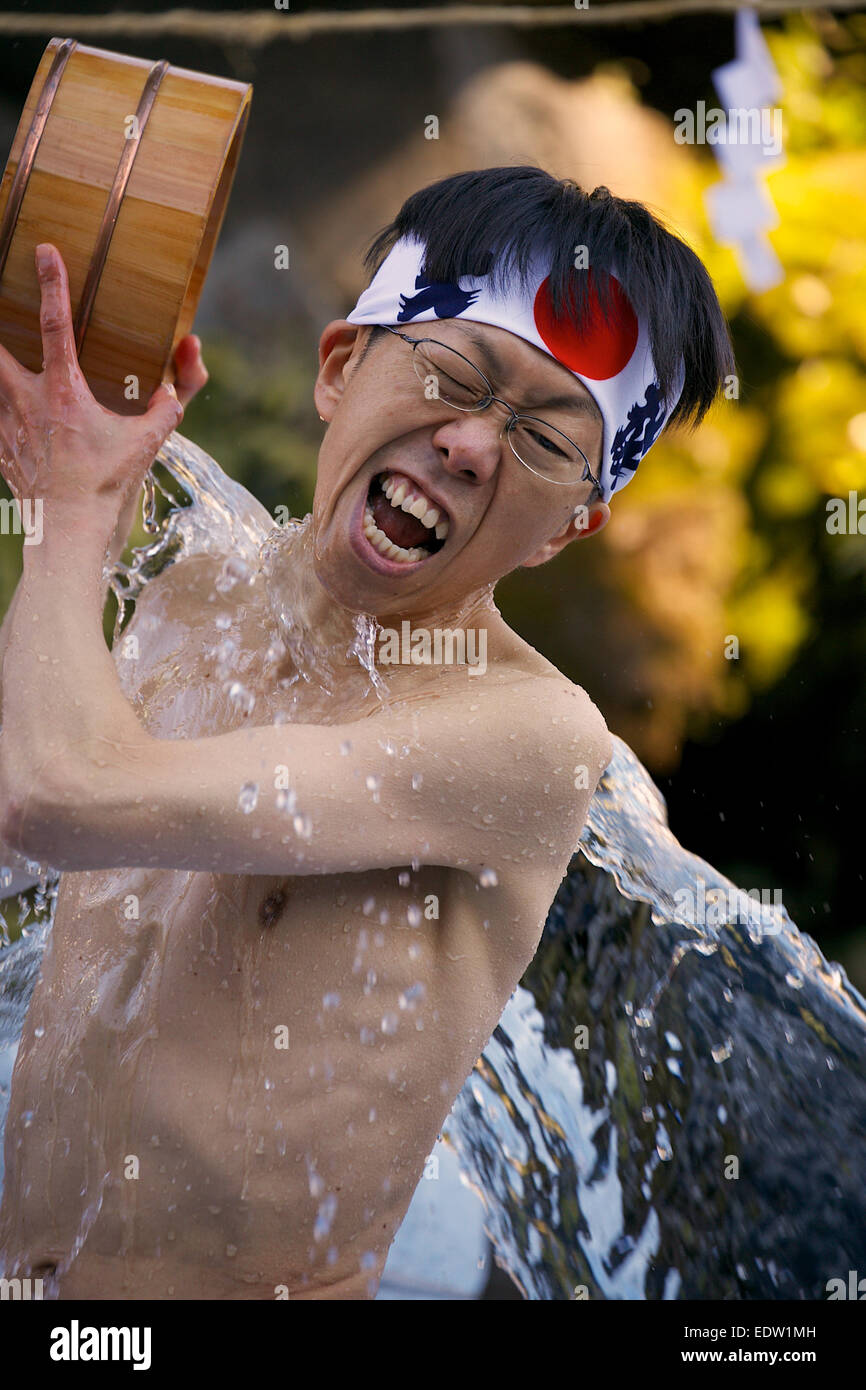 Tokyo, Japan. 10th January, 2015. A participant pours himself cold ...