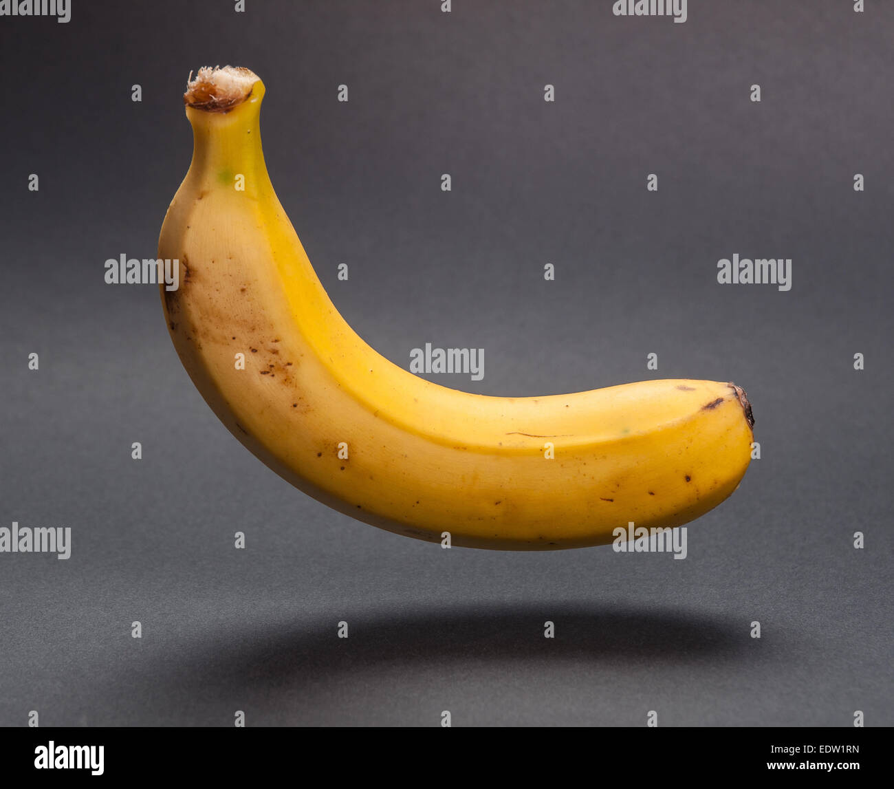 Banana floating isolated on darrk background in a studio shot Stock ...