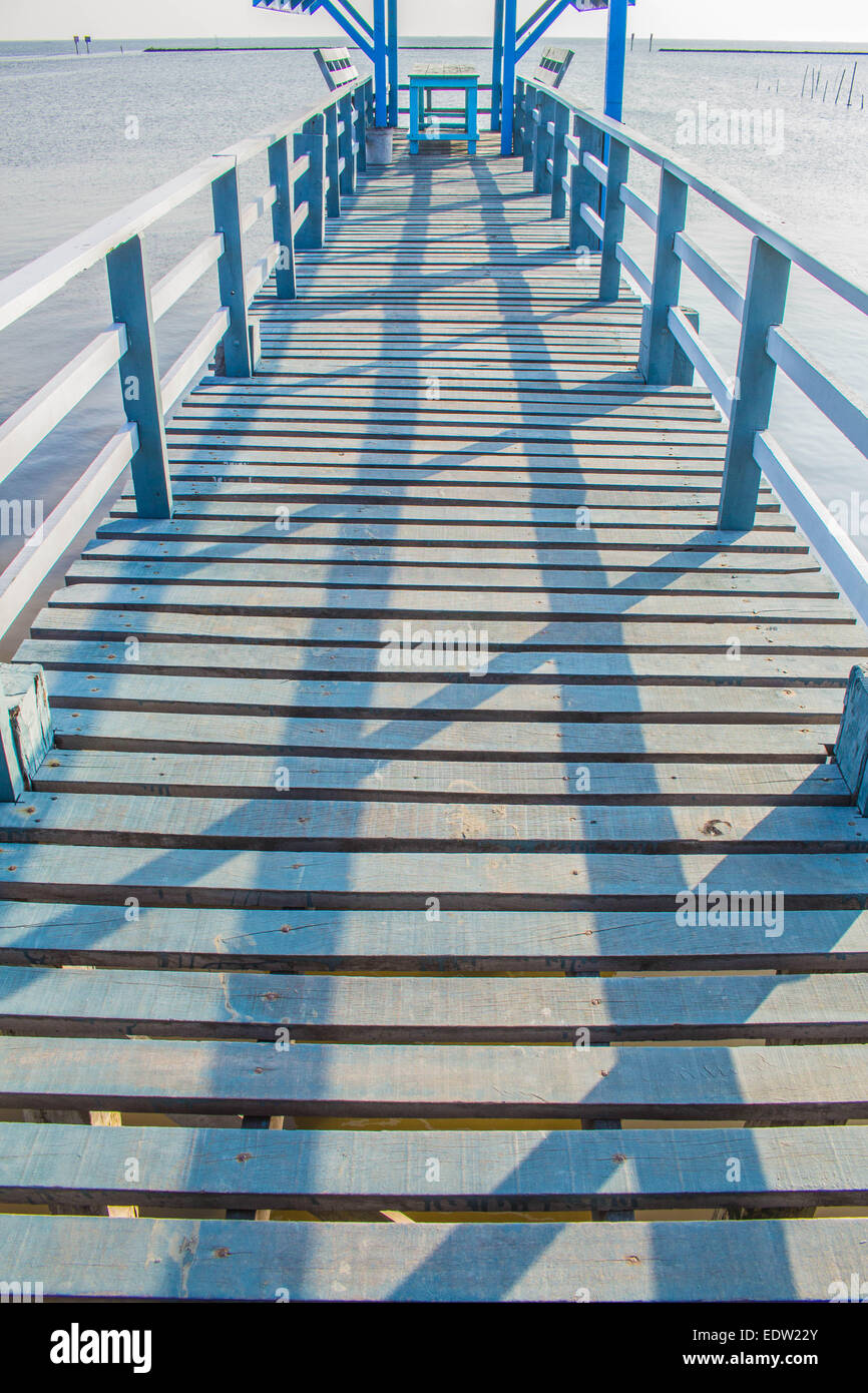 Wooden bridge spanning the sea Stock Photo - Alamy