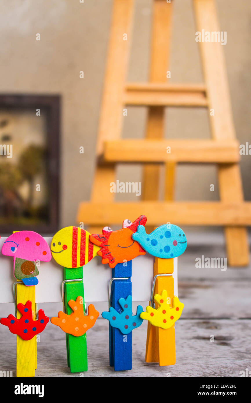 Colorful peg in a row on the wooden floor Stock Photo - Alamy