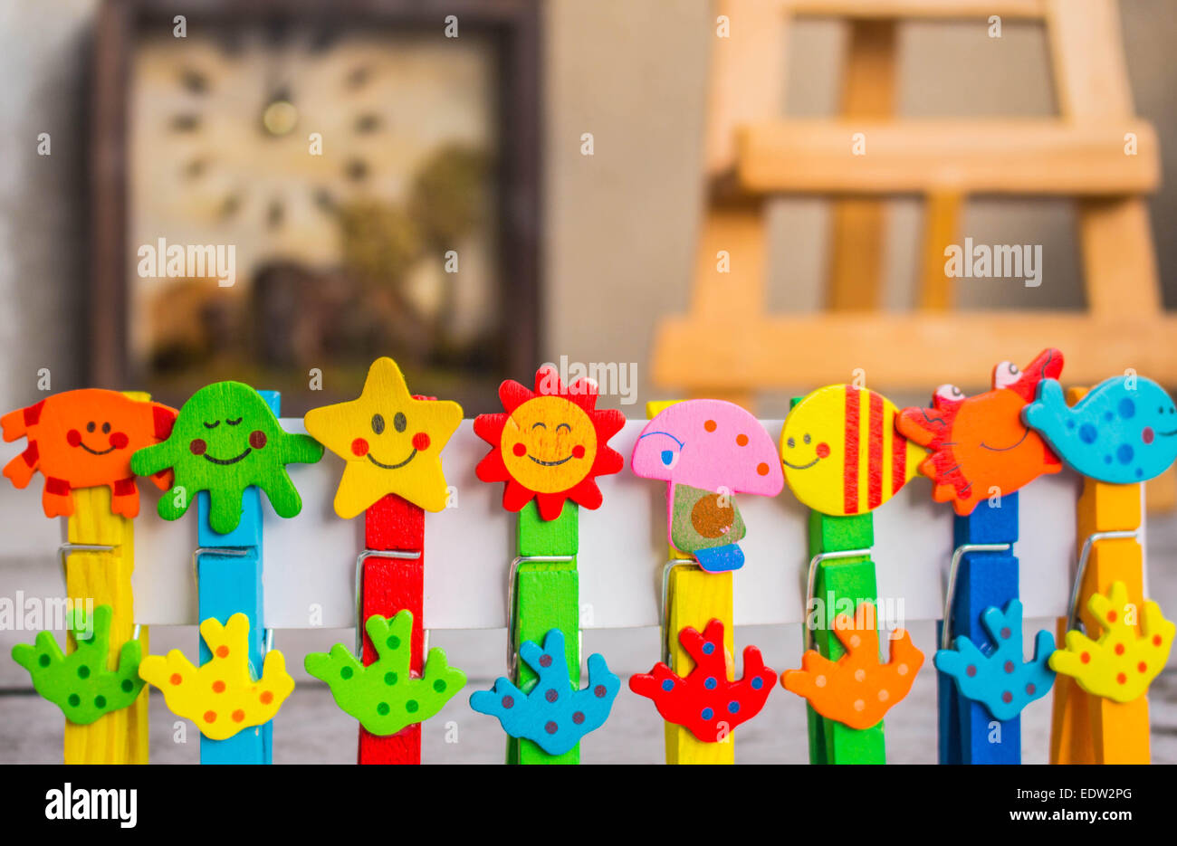 Colorful peg in a row Stock Photo - Alamy