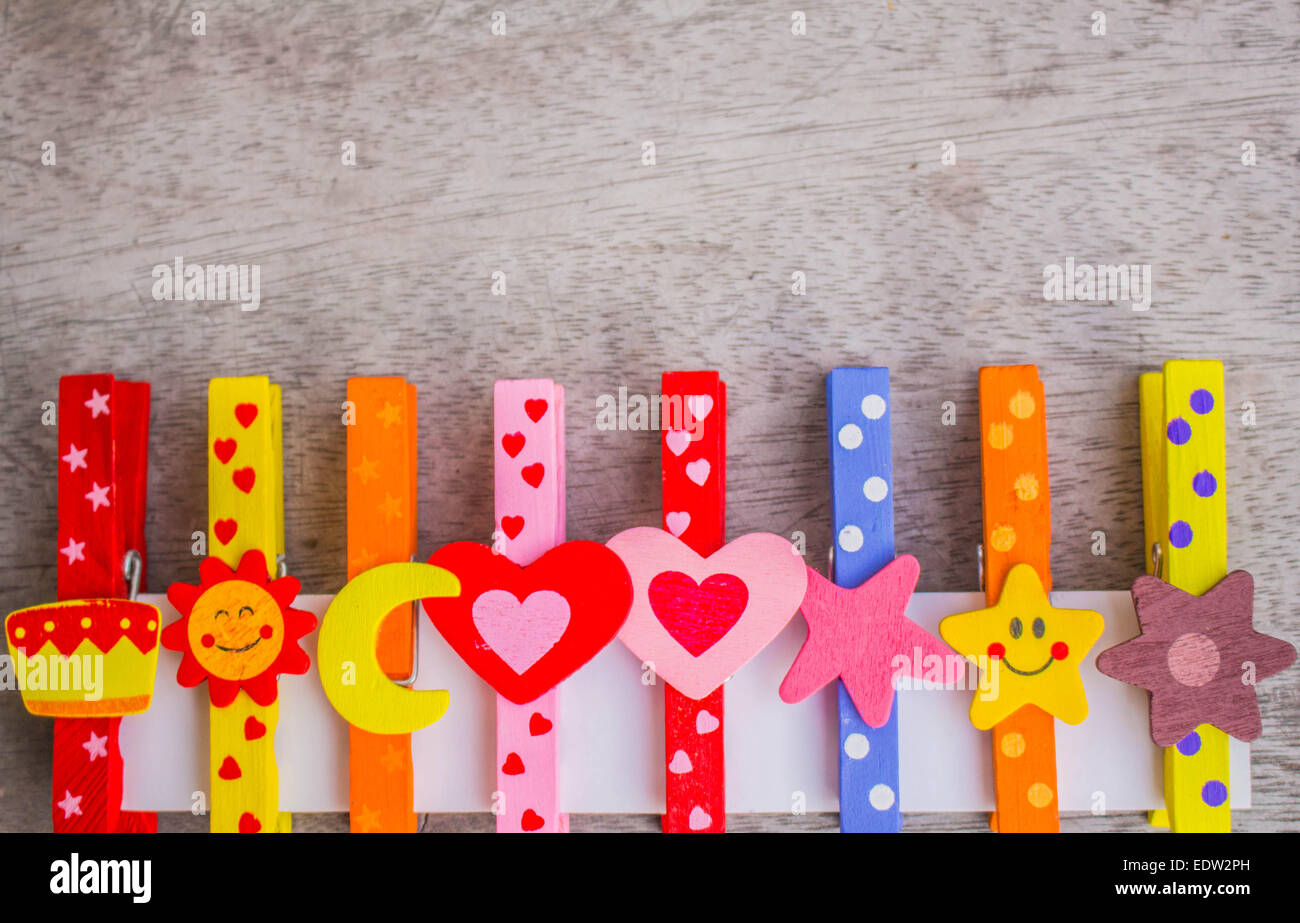 Colorful wooden clamps placed on the table Stock Photo - Alamy