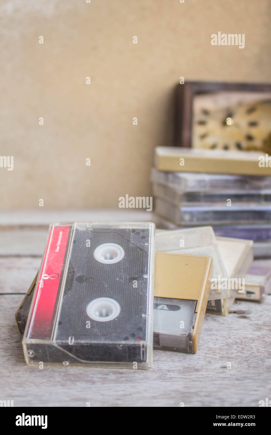 Old cassette arranged on a wooden table Stock Photo - Alamy