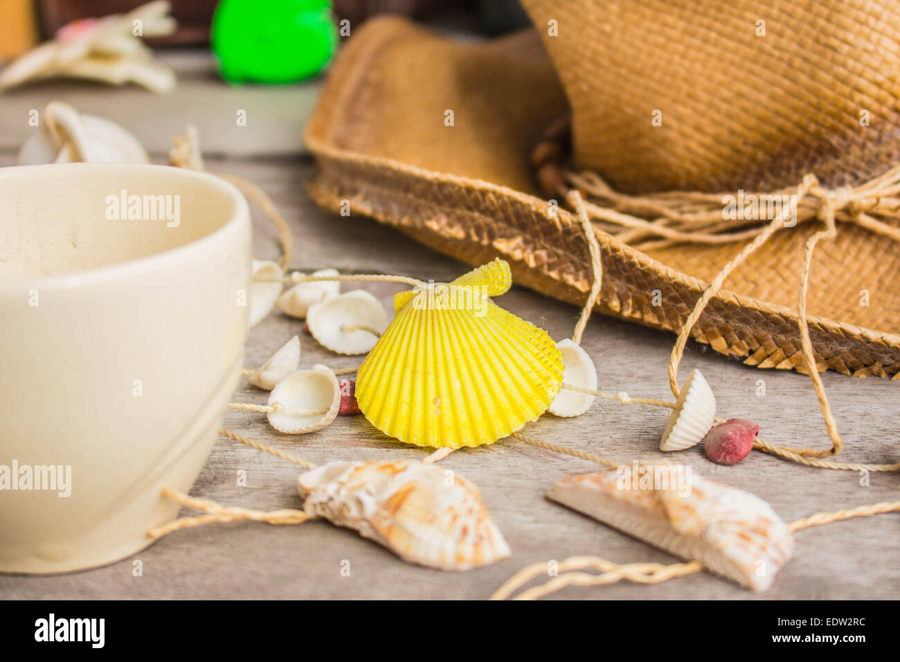 Shells and coffee cup on a wooden floor Stock Photo - Alamy